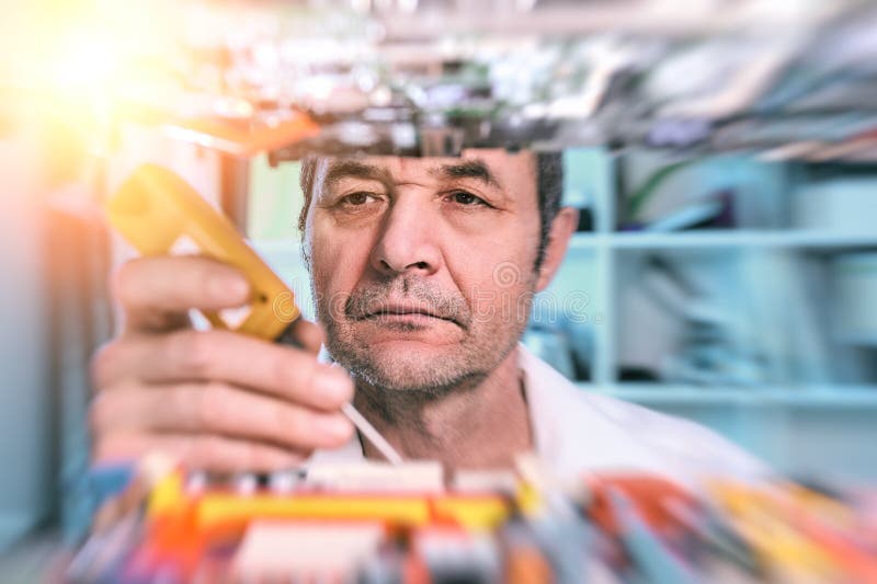 Senior Tech Works In Hartware Repair Facility Stock Image - Image of ...