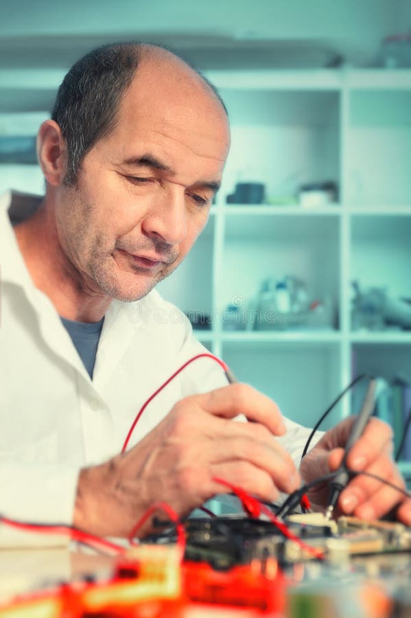 Senior Tech Works in Hartware Repair Facility Stock Image - Image of ...