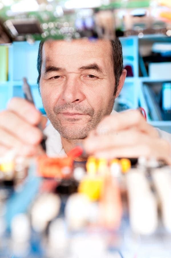 Senior Tech Works in Hartware Repair Facility Stock Image - Image of ...