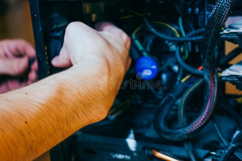 Senior Male Tech Works in Hardware Repair Facility.guy is Assembling a ...