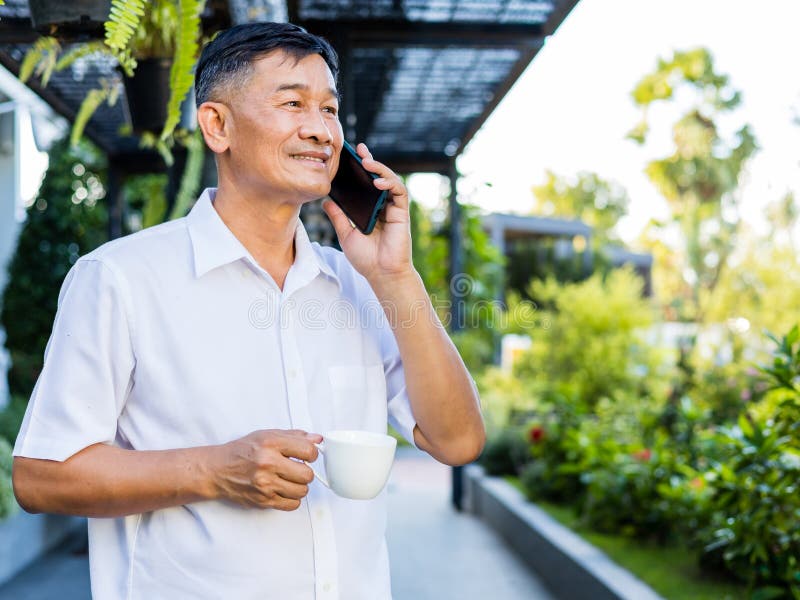 Senior Male Using Smartphone and Drinking Coffee. Senior Lifestyle ...