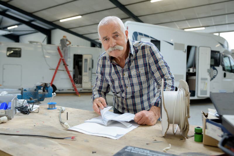 Senior Male Worker in Workshop Stock Image - Image of talking, measure ...