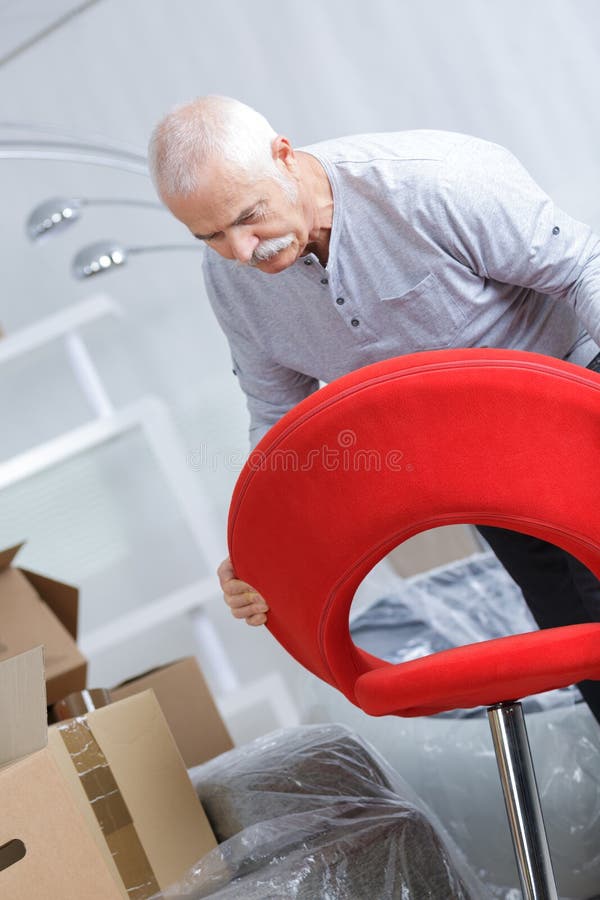Senior Man Assembling Chair before Moving Stock Image - Image of ...