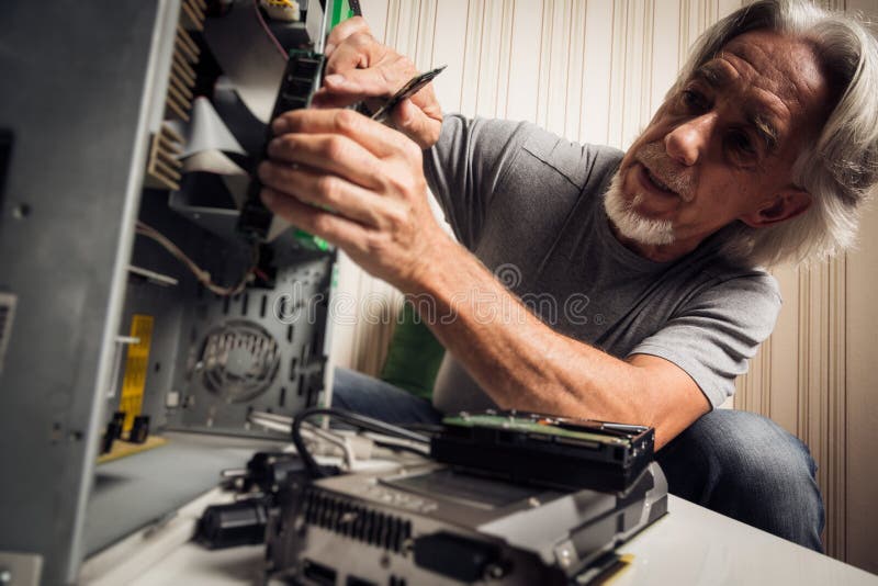 Senior Man Assembling a Desktop Computer Stock Photo - Image of sitting ...