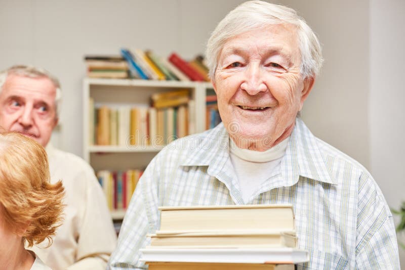 Senior As a Librarian Sorts Books Stock Photo - Image of library, read ...