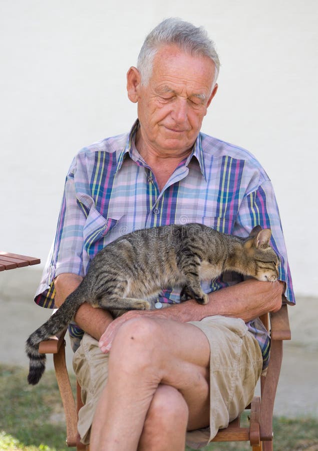 Senior man with cat stock photo. Image of grandparent - 32511864