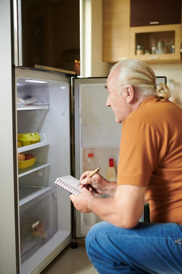 Senior Man Checking Fridge in Kitchen Stock Photo - Image of eating ...