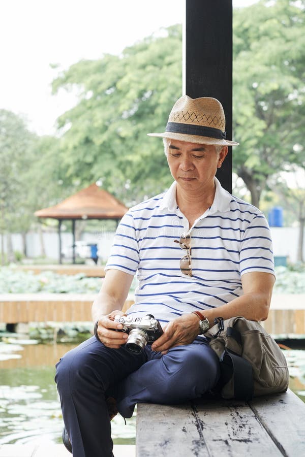Senior Man Checking Photos on Camera Stock Image - Image of smiling ...