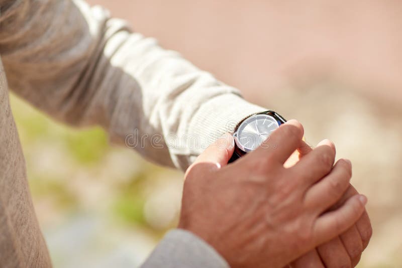 Senior Man Checking Time on Wristwatch Outdoors Stock Image - Image of ...