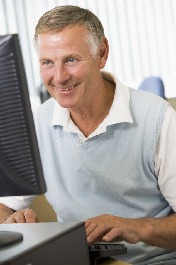 Senior man on a computer stock image. Image of lesson - 6080507