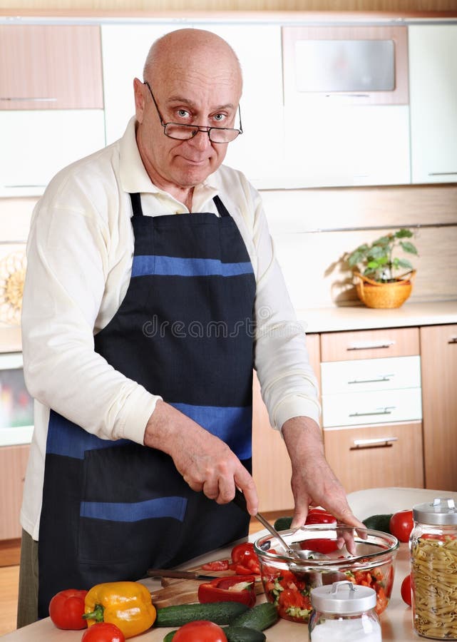 Senior Man Cooking in Kitchen Stock Photo - Image of smiling, cooking ...