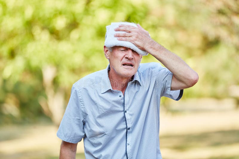 Senior Man Cools His Head with Wet Cloth Stock Photo - Image of faint ...