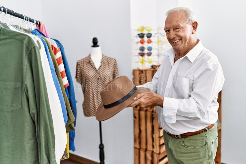 Senior Man Customer Holding Hat at Clothing Store Stock Photo - Image ...