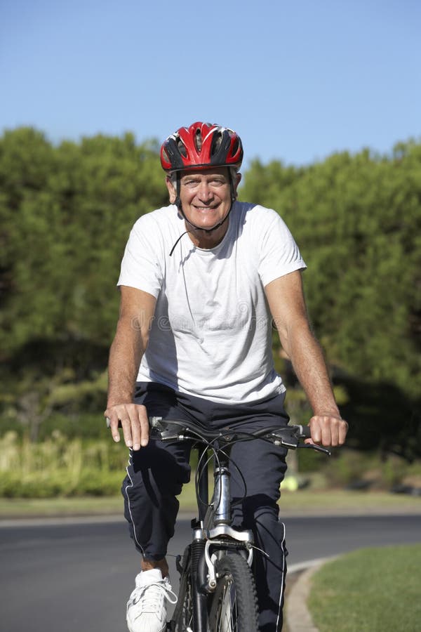 Senior Man on Cycle Ride stock photo. Image of ride, exercising - 54936298