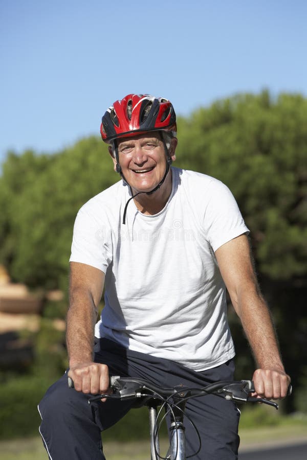 Senior Man on Cycle Ride stock photo. Image of portrait - 55891350