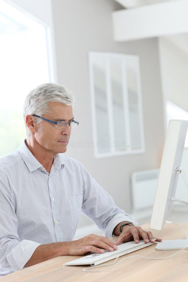 Senior Man on Desktop Computer Writing Stock Image - Image of lifestyle ...
