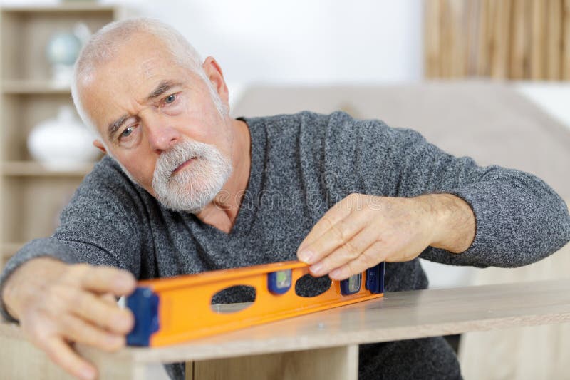 Senior man doing diy works stock photo. Image of carpenter - 272190038