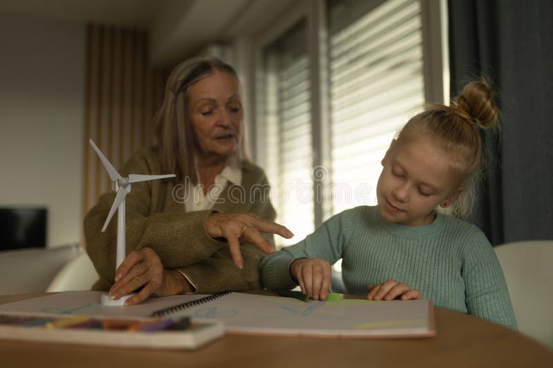 Senior Man Doing Homework with His Granddaughter. Stock Photo - Image ...