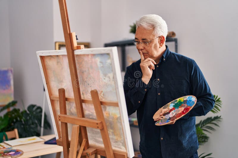 Senior Man Drawing with Serious Expression at Art Studio Stock Image ...