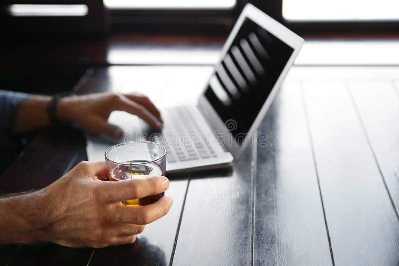 Senior Man Drinking Whiskey while Working on Laptop in Pub, Closeup ...