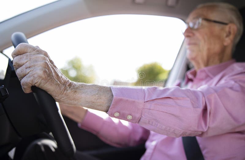 Senior Man Driving Car with Close Up of Hands on Steering Wheel Stock ...
