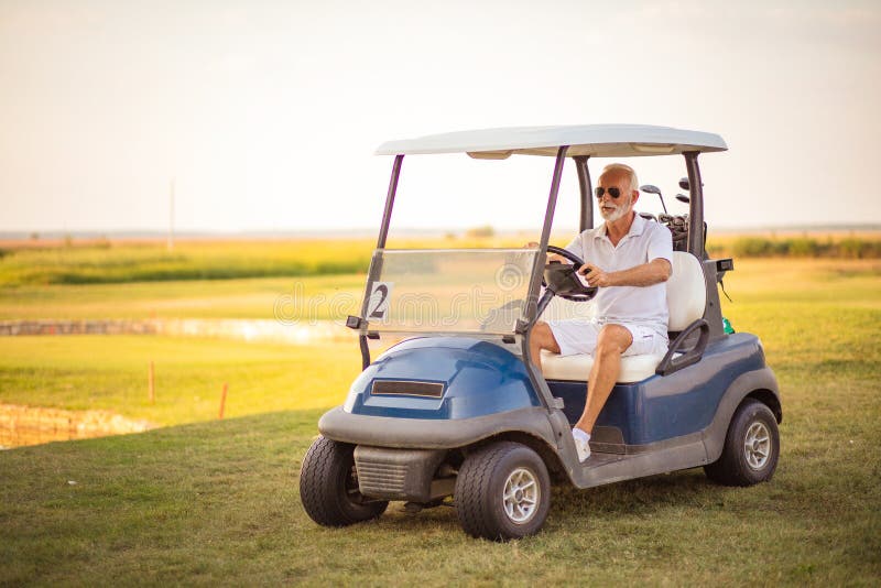 Man driving golf car stock photo. Image of cart, match - 214378696