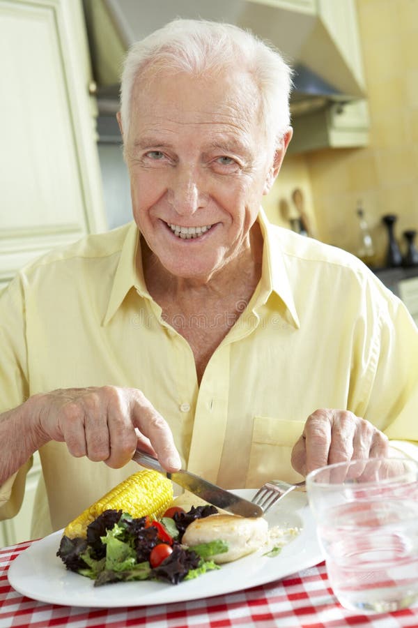 Senior Man Eating Meal in Kitchen Stock Photo - Image of eighties ...