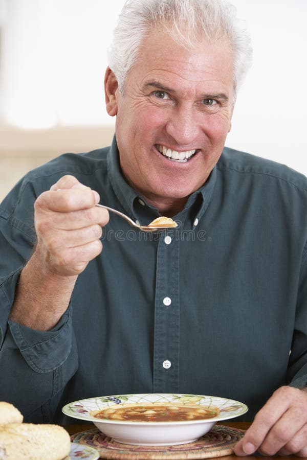 Senior Man Eating Soup, Smiling At The Camera Stock Image - Image: 7876351