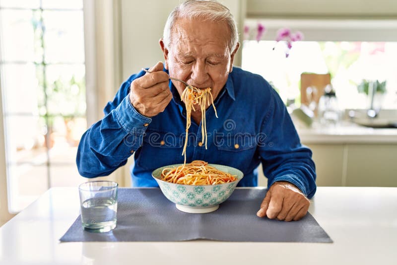Senior Man Eating Spaghetti at Kitchen Stock Photo - Image of tasty ...