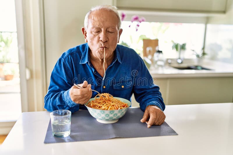 Senior Man Eating Spaghetti at Kitchen Stock Image - Image of middle ...