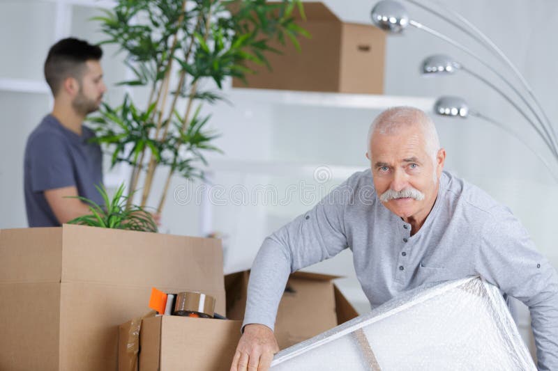 Senior Man in Empty Room with Packed Moving Boxes Stock Image - Image ...