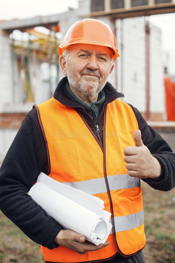 Senior Man Engineer or Construction Worker in Hardhat Approving ... Senior Man Engineer or Construction Worker in Hardhat Approving ...