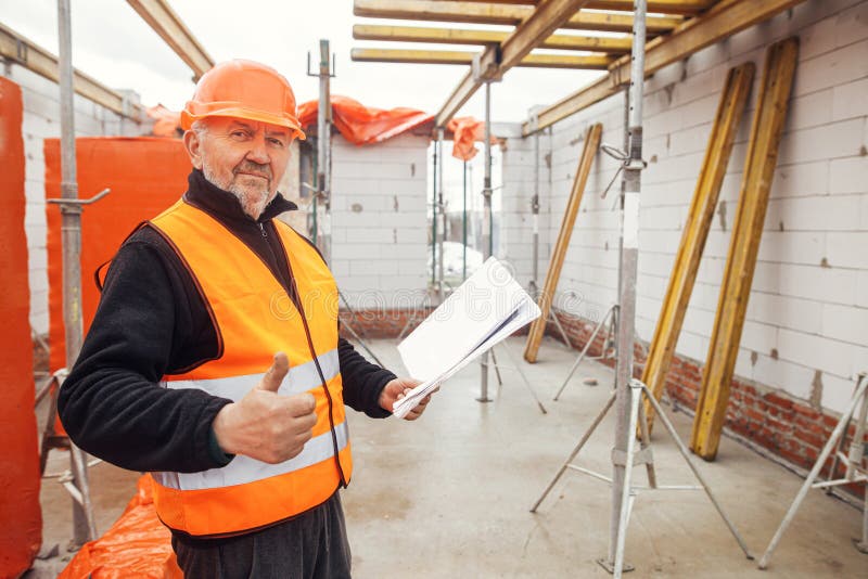 Senior Man Engineer or Construction Worker in Hardhat Approving ... Senior Man Engineer or Construction Worker in Hardhat Approving ...