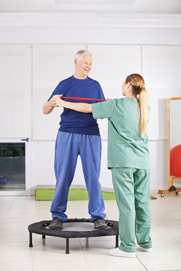 Senior Man with Exercise Band on Trampoline Stock Photo - Image of ...