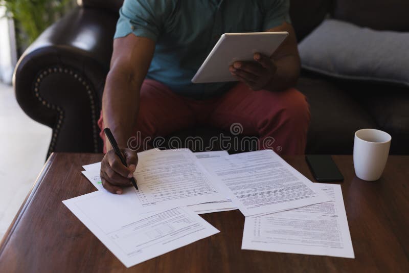 Man Filling Out Form Close Up in Front of Blurred Background Stock ...