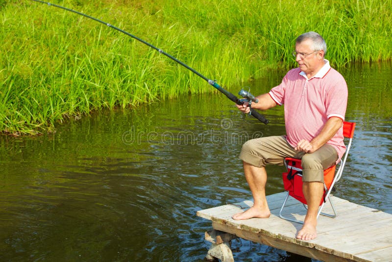 Older Man Fishing at Lake stock image. Image of lake, lakes - 7458375