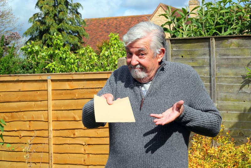 Senior Man Giving a Plain Brown Envelope. Stock Image - Image of secret ...