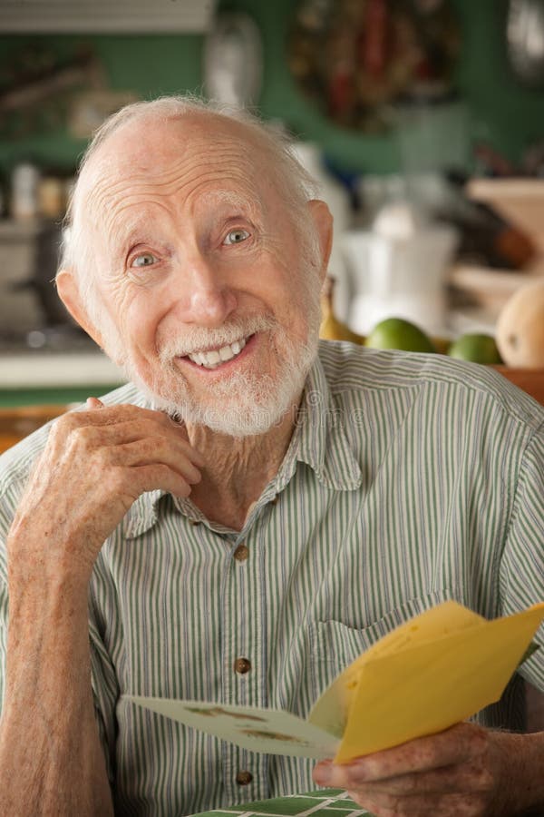 Senior Man with Greeting Card Stock Photo - Image of expression, home ...