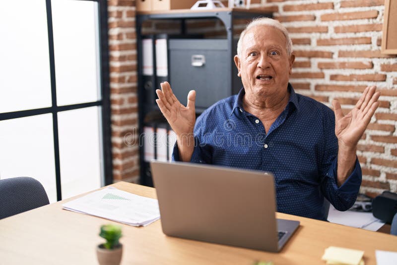 Senior Man with Grey Hair Working Using Computer Laptop at the Office ...