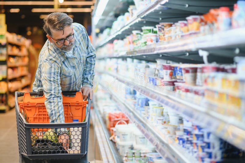 Senior Man at Grocery Store Products Stock Image - Image of choosing ...