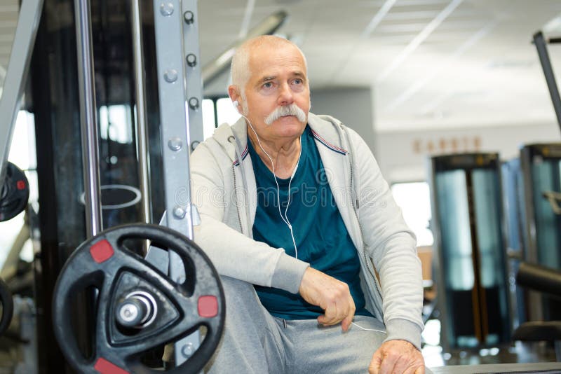 Senior Man in Gym Working Out Stock Image - Image of elderly ...