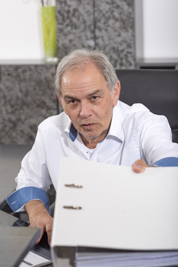 Senior Man Hands Over a File Folder Stock Photo - Image of central ...