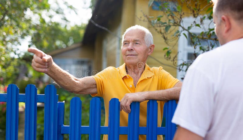 Senior Man Having Conversation with His Neighbour Stock Image - Image ...