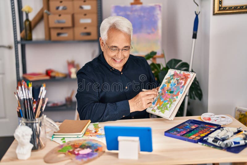 Senior Man Having Online Draw Lesson Sitting on Table at Art Studio ...