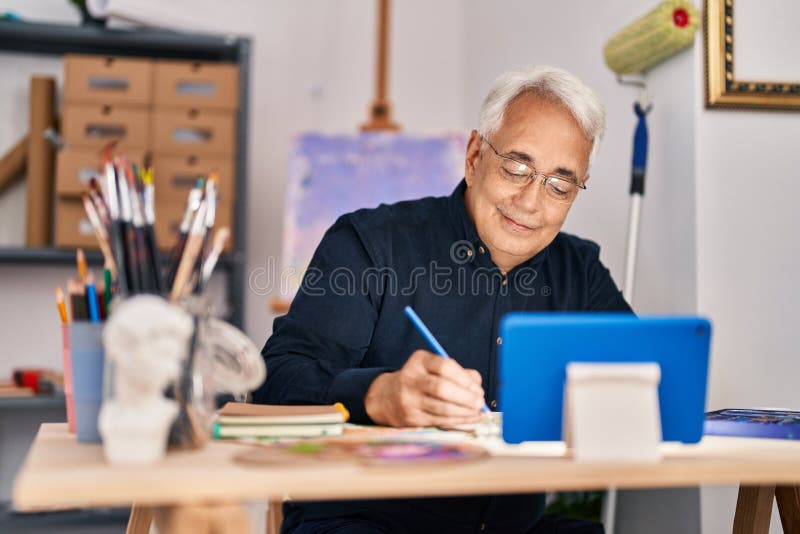 Senior Man Having Online Draw Lesson Sitting on Table at Art Studio ...