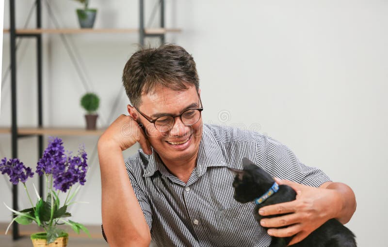 Old Thai Man Nursing Black Dog Stock Photos - Free & Royalty-Free Stock ...