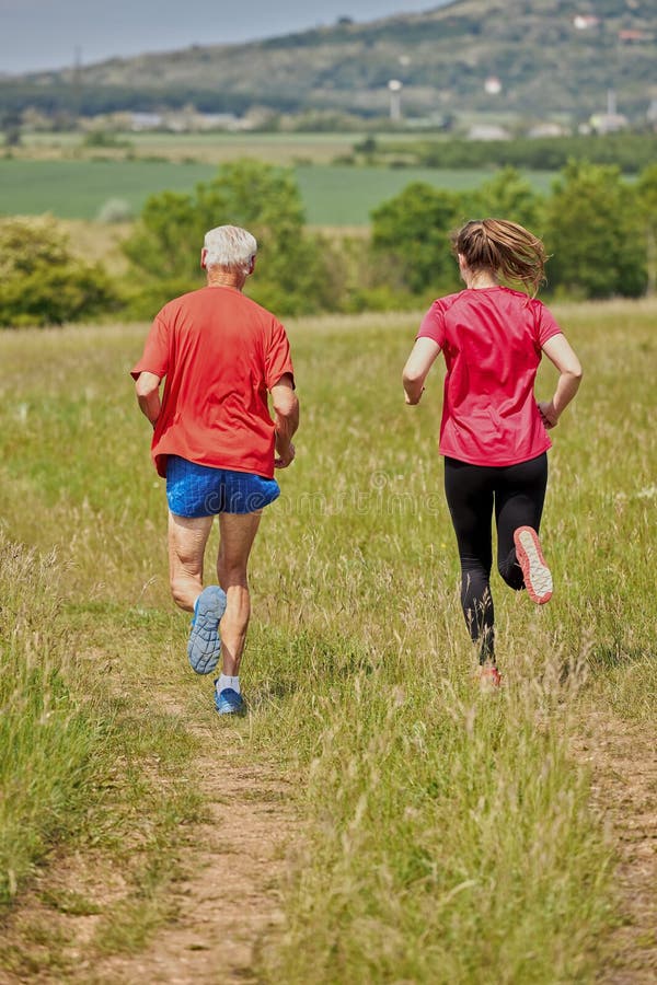 Two people running stock photo. Image of leisure, exercise - 13044040