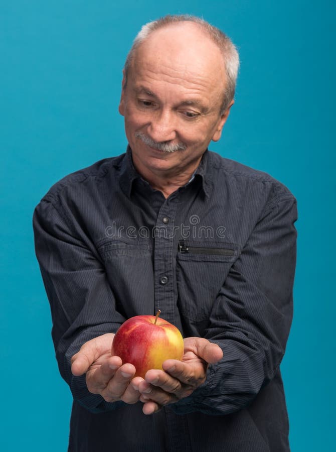 Mysterious Man Holding an Apple Stock Image - Image of gangster ...