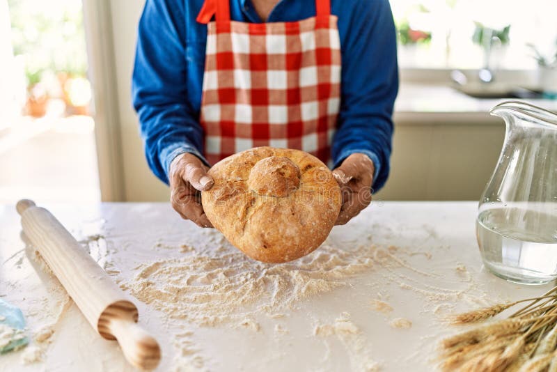 Senior Man Holding Homemade Bread at Kitchen Stock Photo - Image of ...