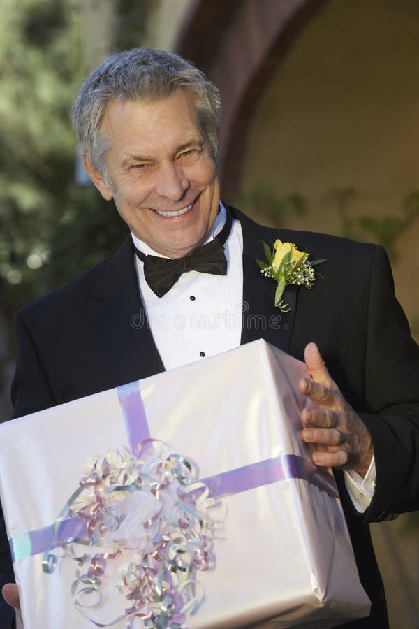 Senior Man Holding Present stock photo. Image of baby - 29657964